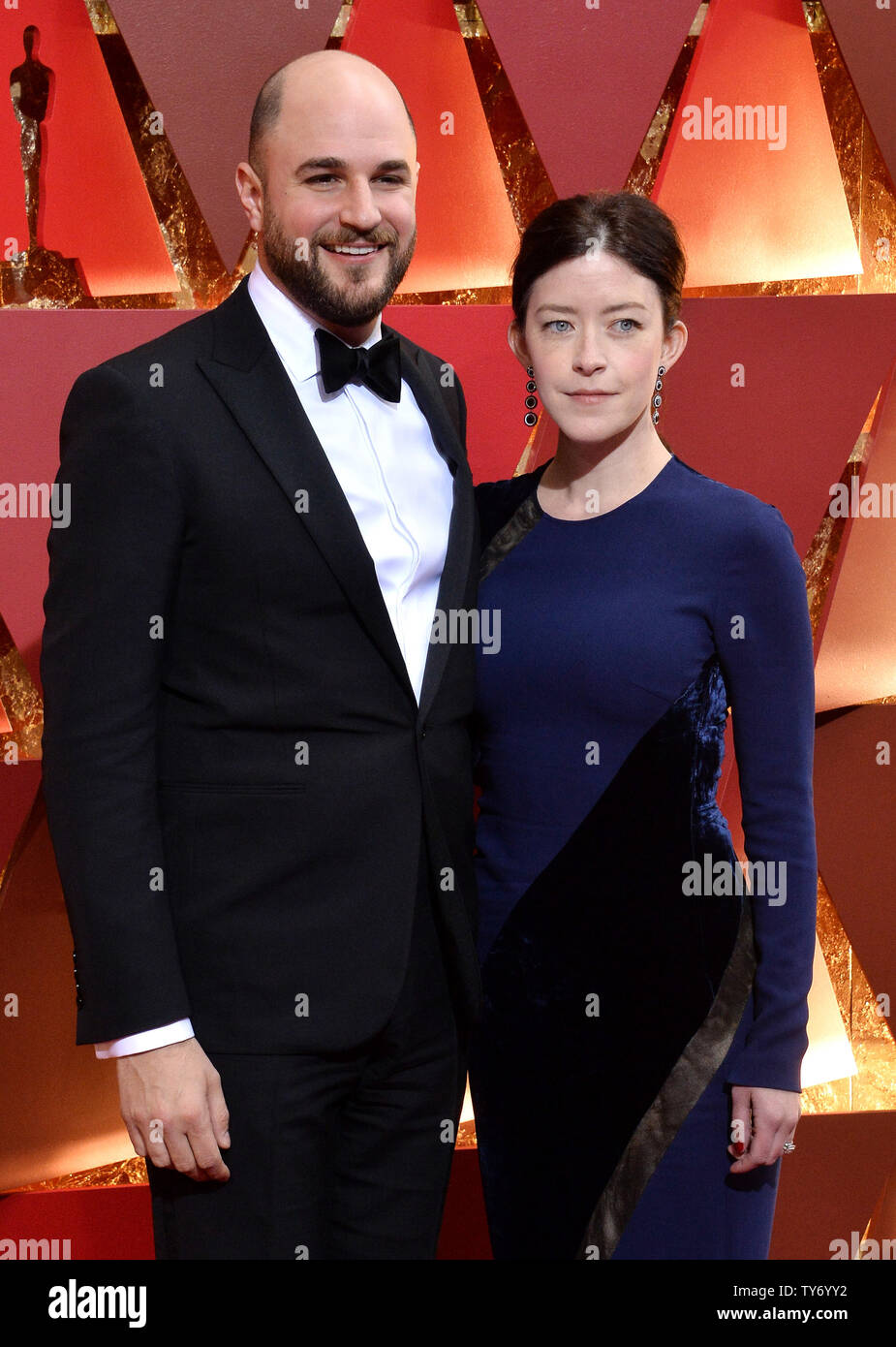 Producer Jordan Horowitz (L) and guest arrive on the red carpet for the ...