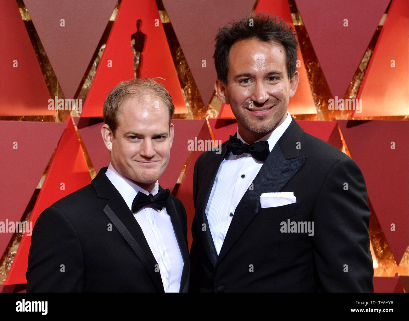 Stephen Ellis (L) and Marcel Mettelsiefen arrive on the red carpet for ...