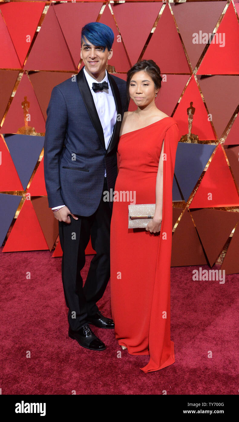 Visual effects supervisor Mohen Leo and guest arrive on the red carpet ...