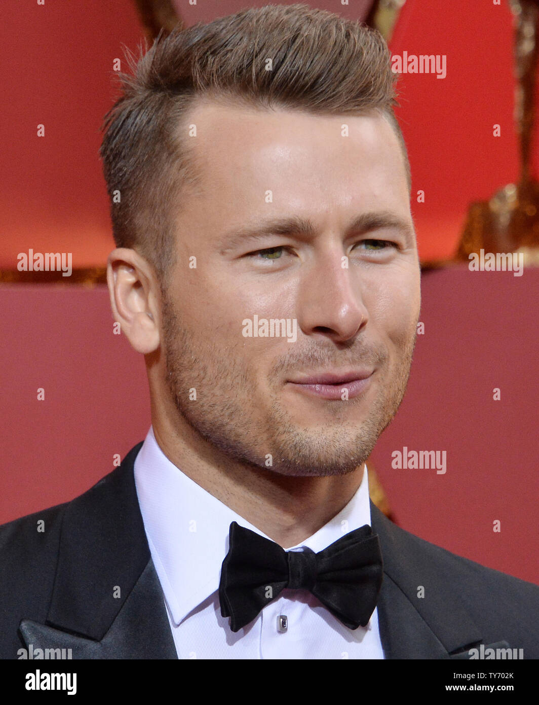 Actor Glen Powell arrives on the red carpet for the 89th annual Academy ...