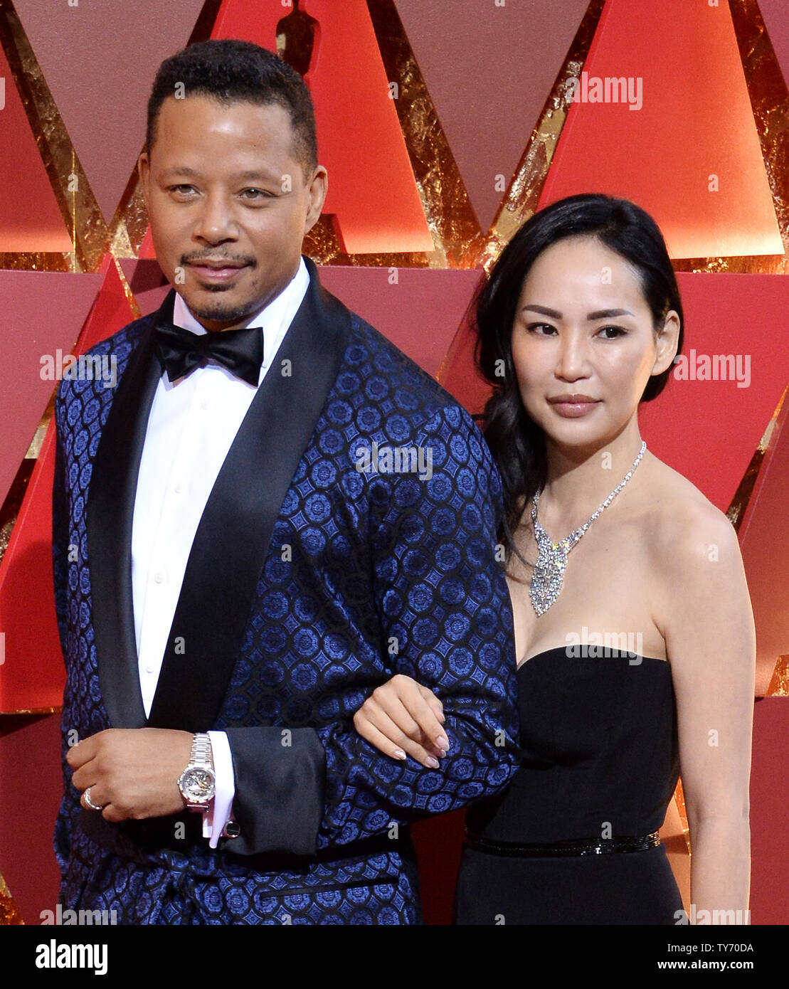 Actor Terrence Howard (L) and Mira Pak arrive on the red carpet for the ...