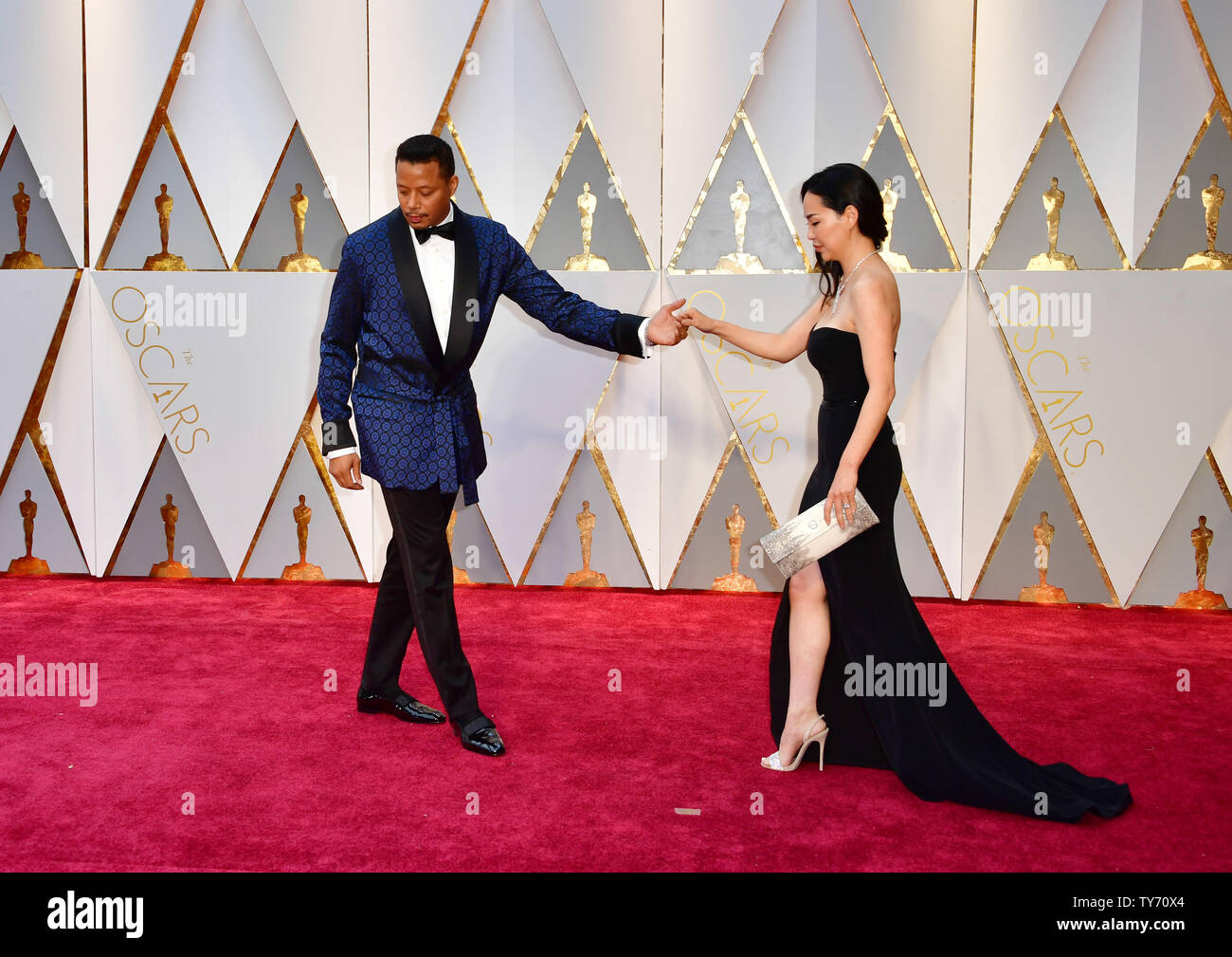 Terrence Howard and Mira Pak arrive on the red carpet for the 89th ...