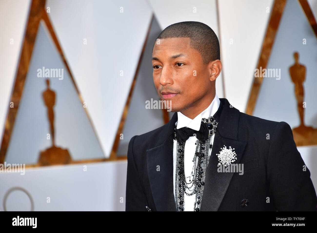 Pharrell Williams arrives on the red carpet for the 89th annual Academy ...