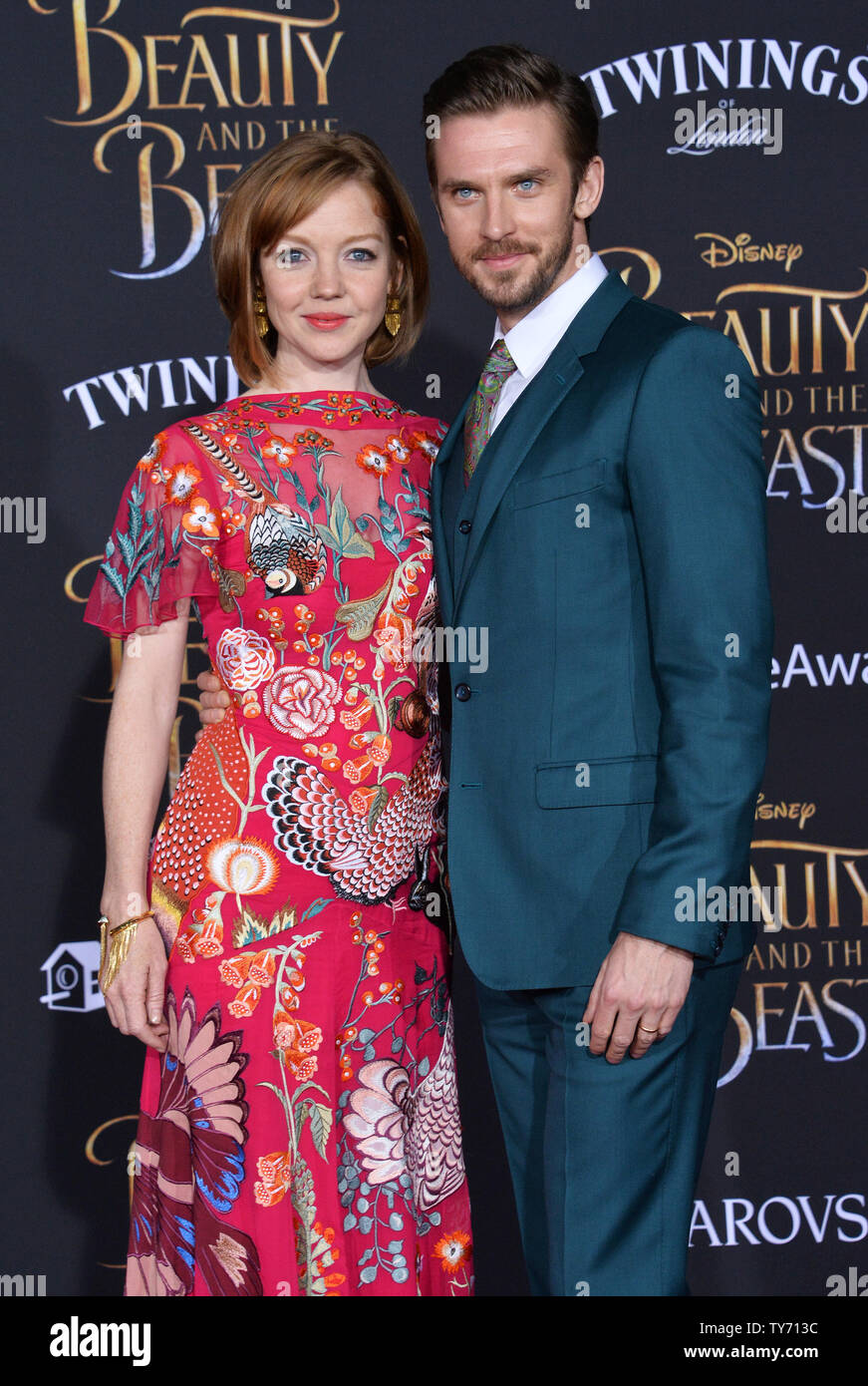 Cast member Dan Stevens and his wife Susie Hariet attend the premiere ...