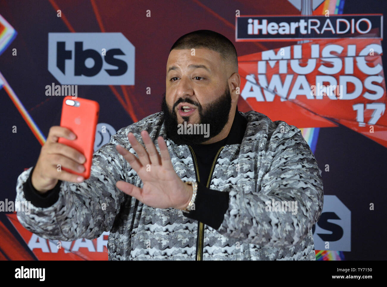 Rapper DJ Khaled appears backstage during the iHeartRadio Music Awards ...