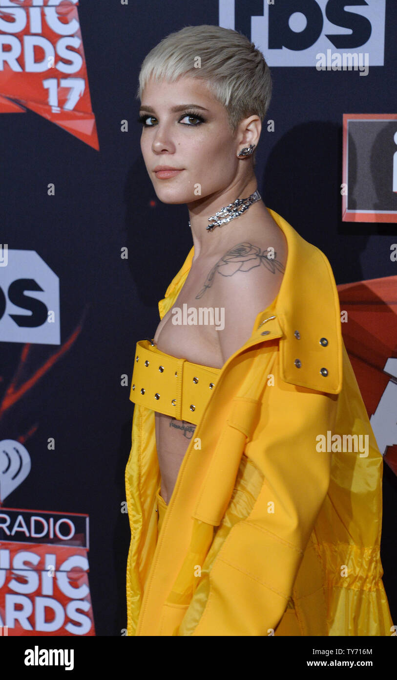 Singer Halsey arrives for the iHeartRadio Music Awards at The Forum in ...