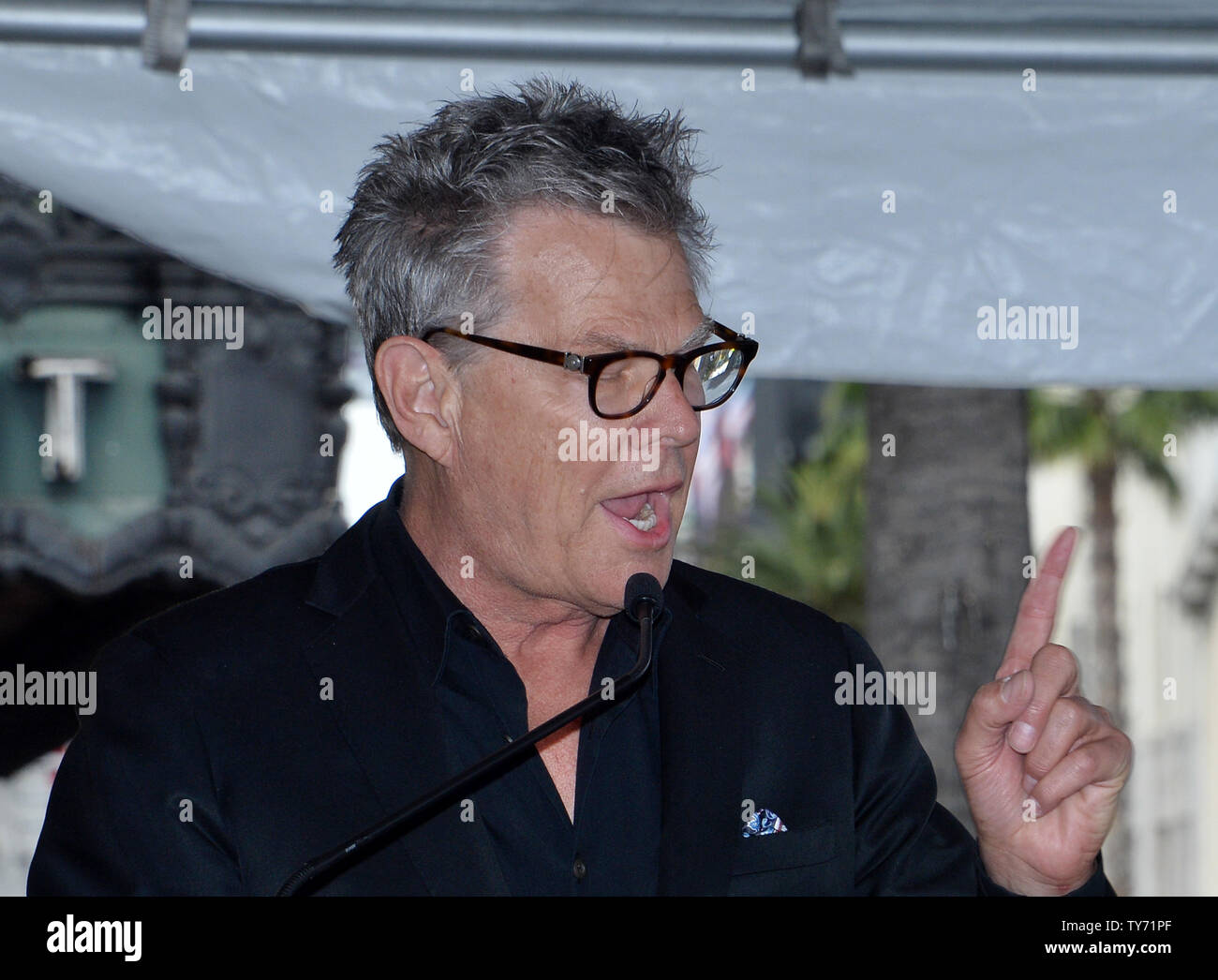 Television producer and creator of the "Power Rangers" holds a replica ...