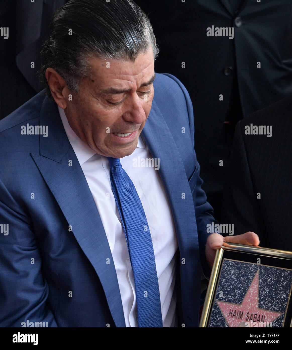 Television producer and creator of the "Power Rangers" holds a replica ...