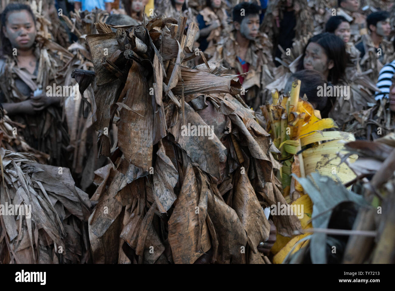 Devotees take part in the ‘Taong Putik’ or mud people festival in the ...