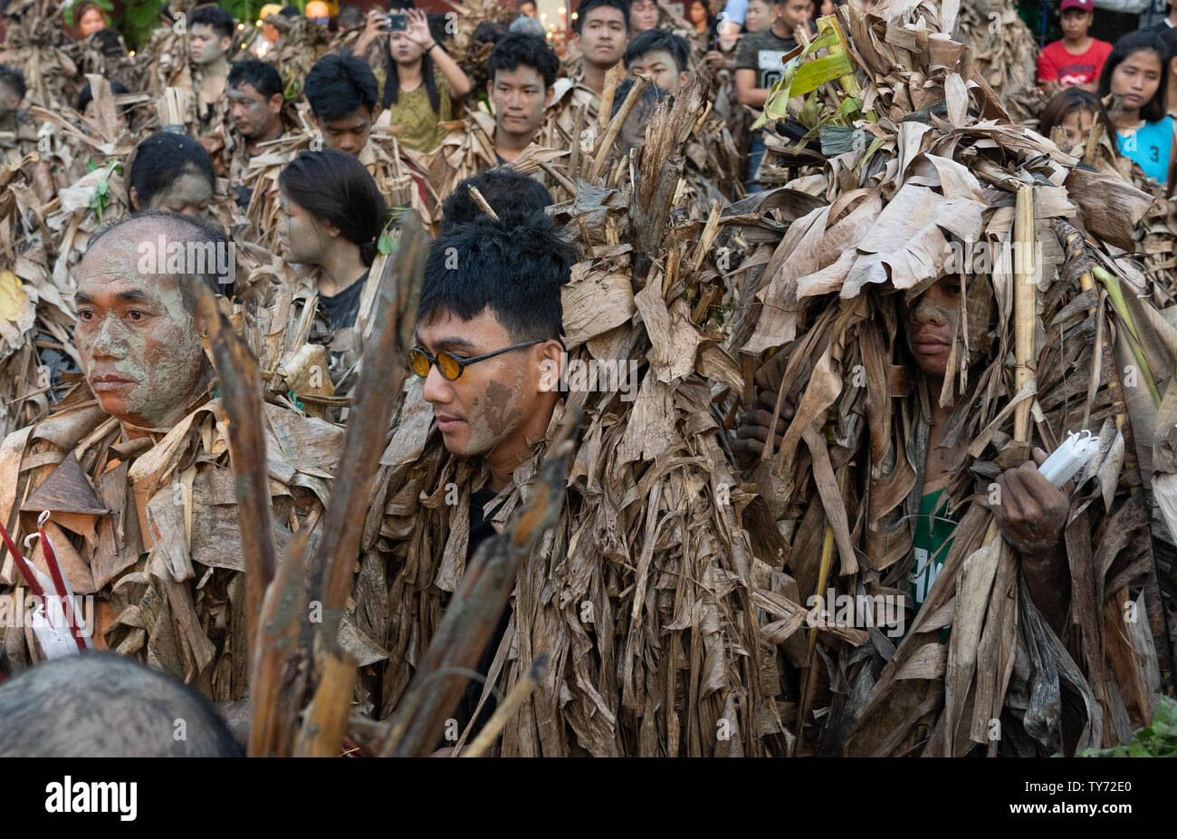 Devotees take part in the ‘Taong Putik’ or mud people festival in the ...