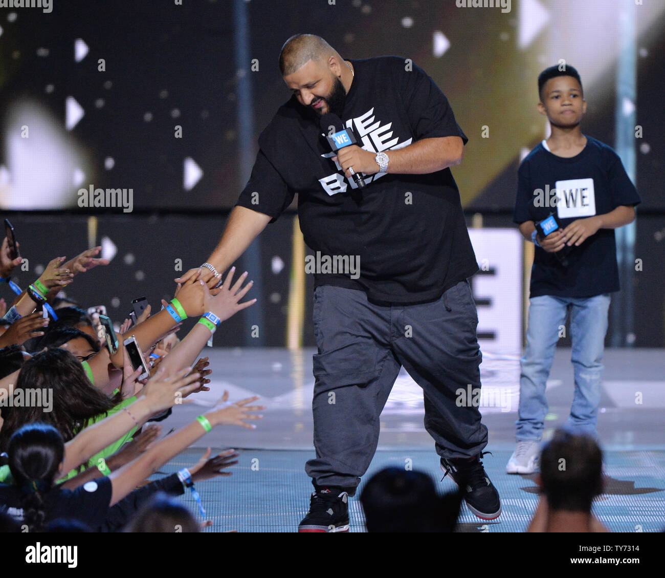 DJ Khaled and Demarjay Smith appear onstage during We Day California at ...