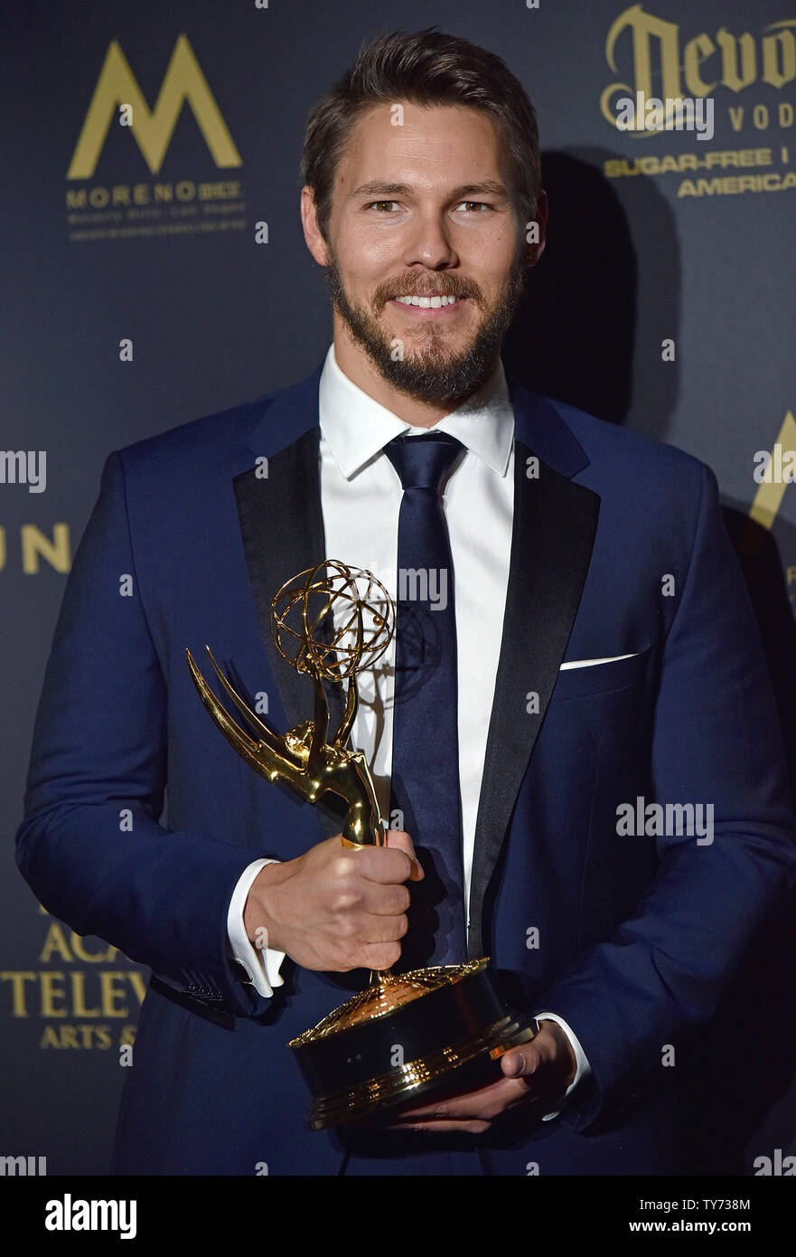Scott Clifton holds up his Daytime Emmy for Outstanding Lead Actor in a ...