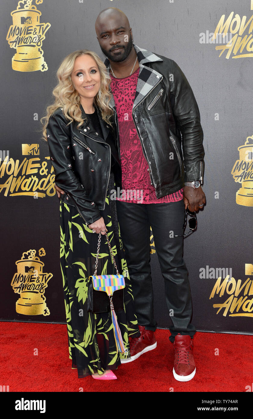 Actor Mike Colter (R) and Iva Colter attend the MTV Movie & TV Awards ...