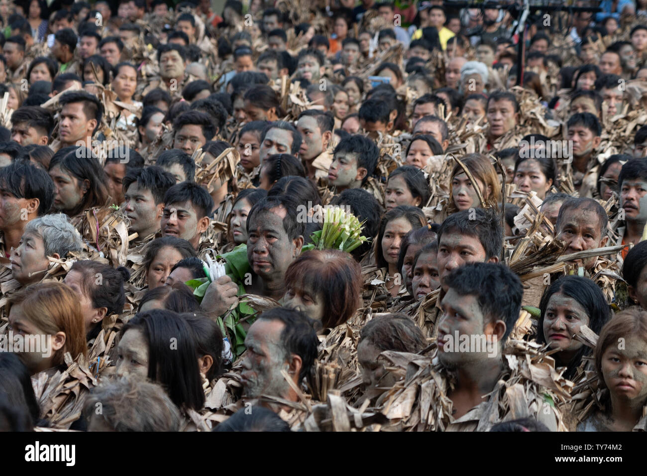 Devotees take part in the ‘Taong Putik’ or mud people festival in the ...