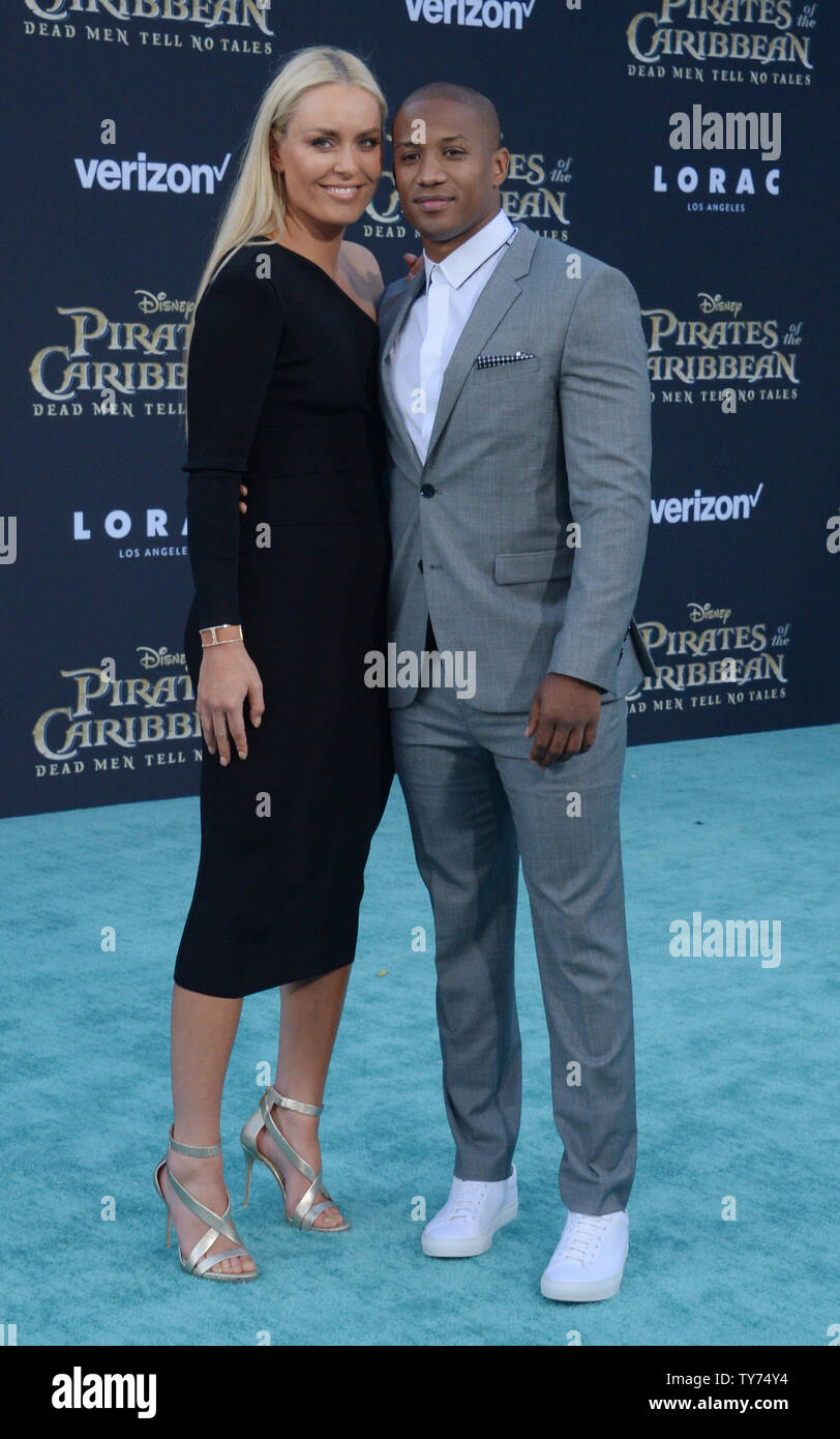 Professional skier Lindsey Vonn (L) and Kenan Smith attend the premiere ...
