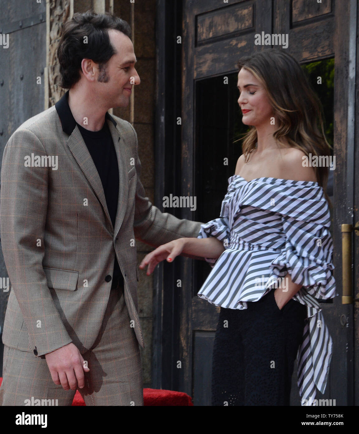 Actress Keri Russell is kissed by her boyfriend, actor Matthew Rhys ...