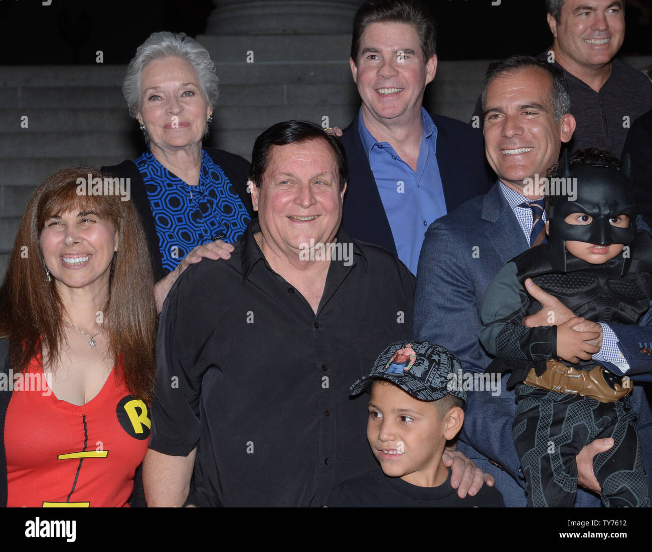 Mayor Eric Garcetti (holding child) is joined by Stacy Posner, and ...