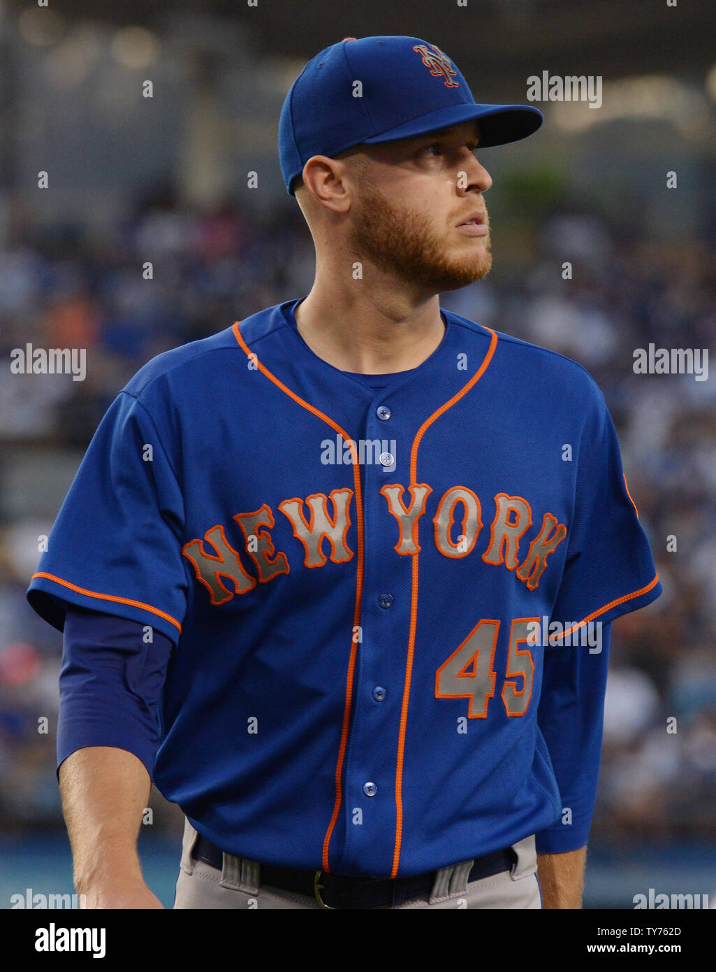 New York Mets' starting pitcher Zach Wheeler walks to the dugout in the ...