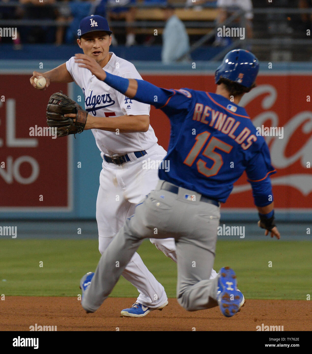 Los Angeles Dodgers' short stop turns a double play in the second ...