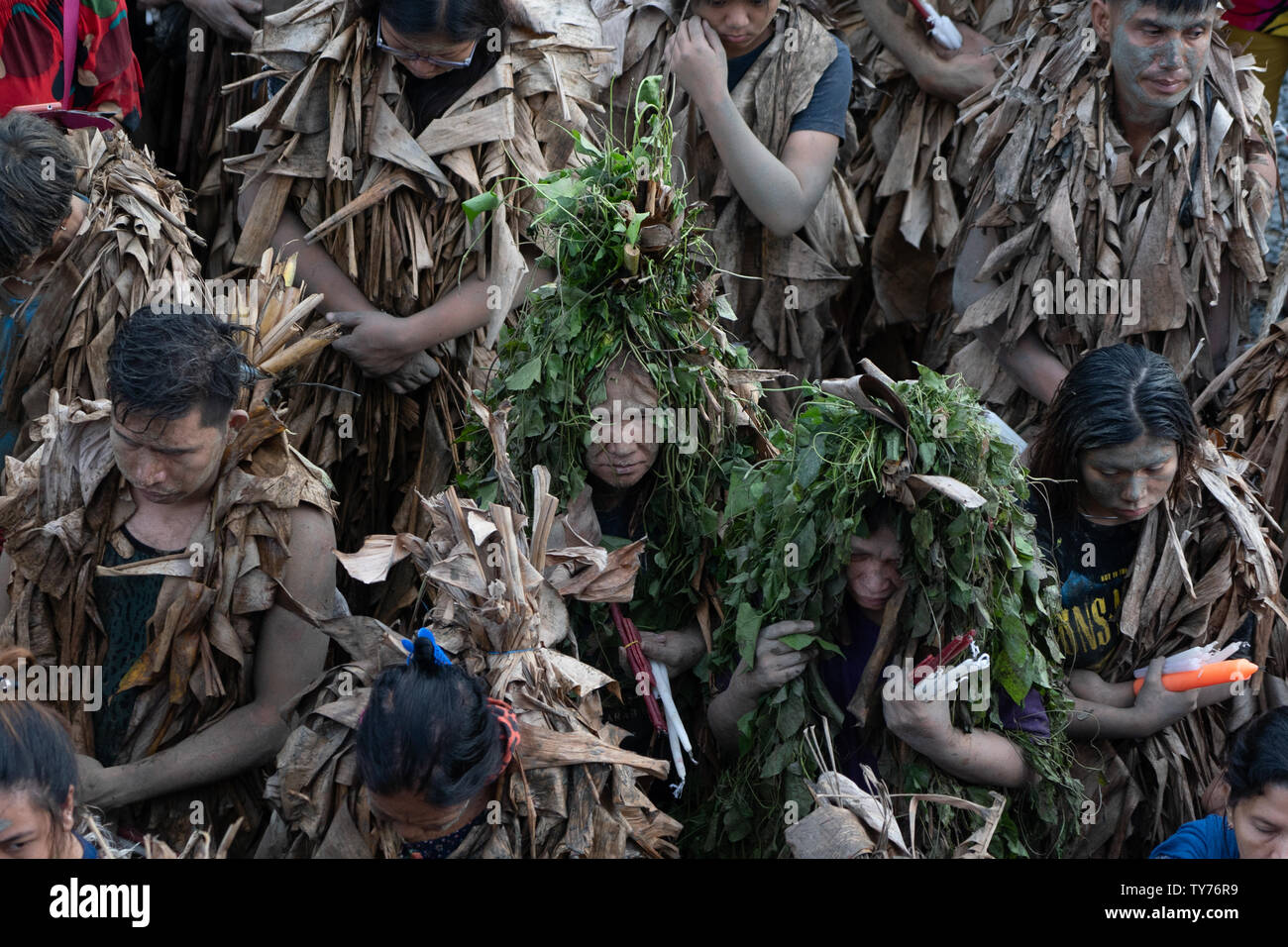 Devotees take part in the ‘Taong Putik’ or mud people festival in the ...