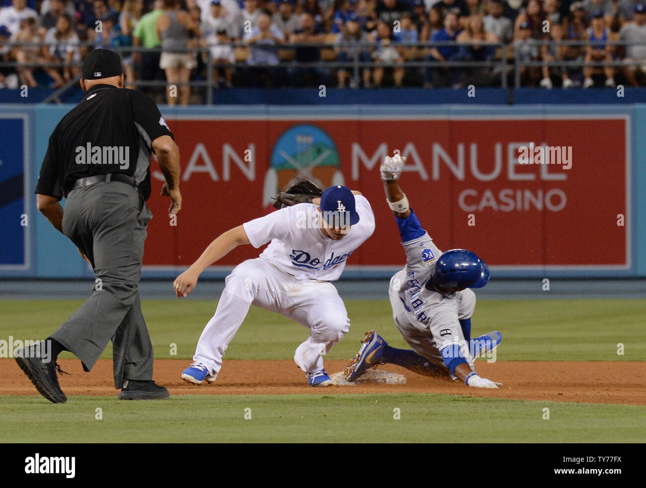 Kansas City Royals' Alcides Escobar is out on the steal attempt as Los Angeles Dodgers' 2nd ...