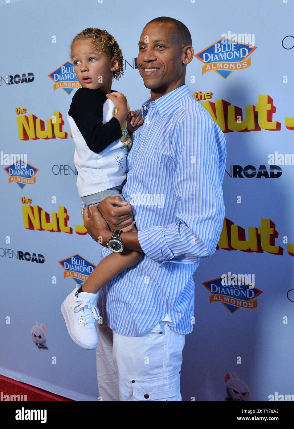 Former NBA player Reggie Miller and his son Ryker attend the premiere ...