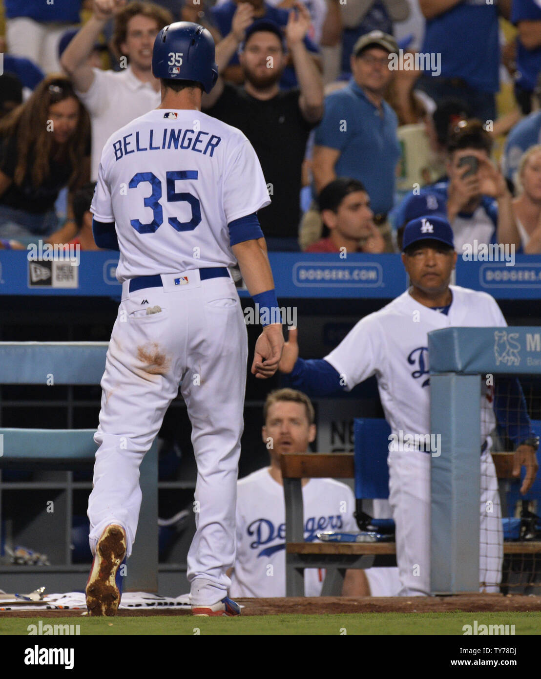 Los Angeles Dodgers' Cody Bellinger is welcomed back to the dugout as ...