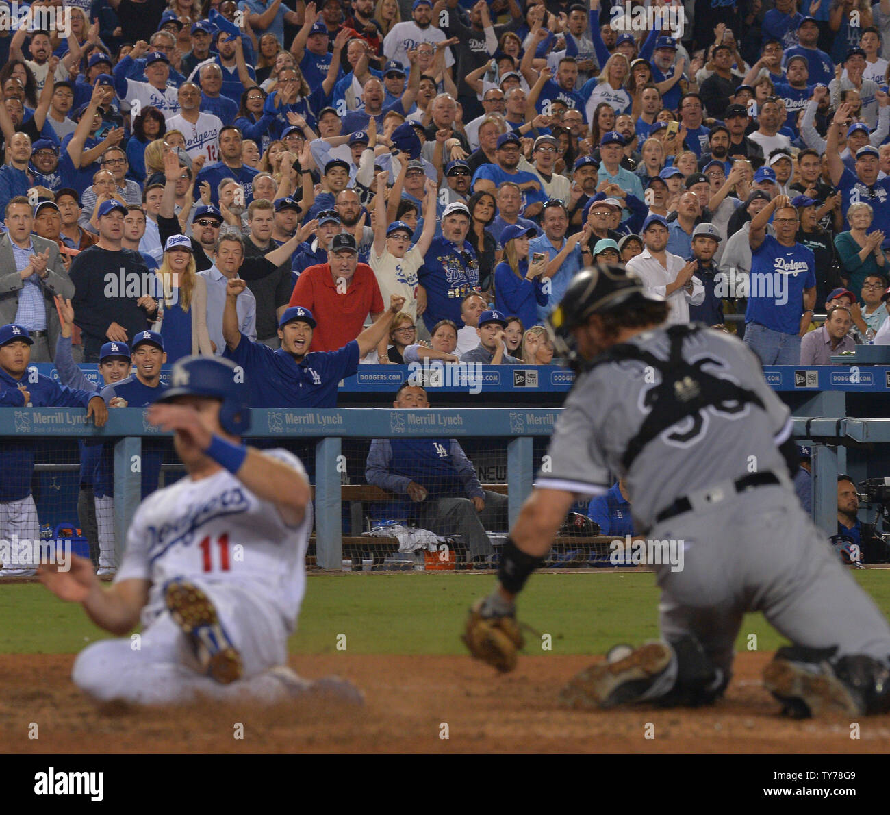 Los Angeles Dodgers' fans celebrate during the Dodgers five-run rally ...