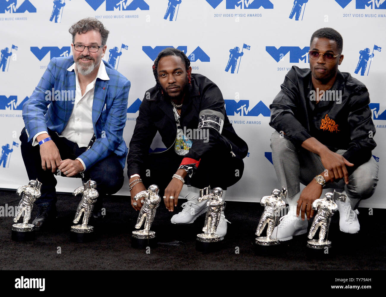 (L-R) Dave Meyers, Kendrick Lamar and Dave Free appear backstage with ...