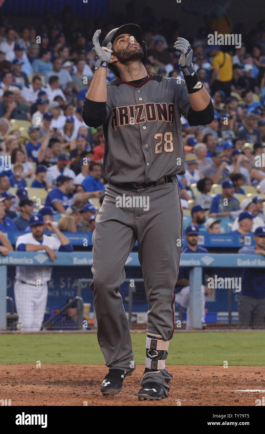 Diamondbacks' J.D. Martinez celebrates the second of his four home runs ...