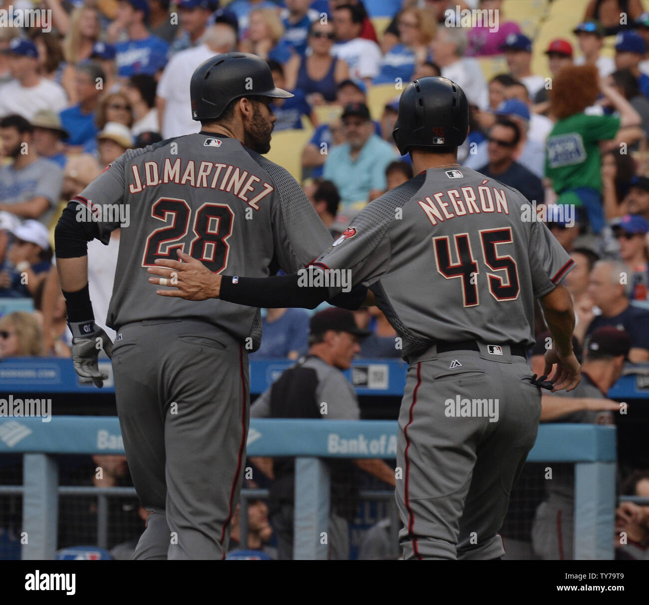 Diamondbacks' J.D. Martinez celebrates with teammate Kristopher Negron ...