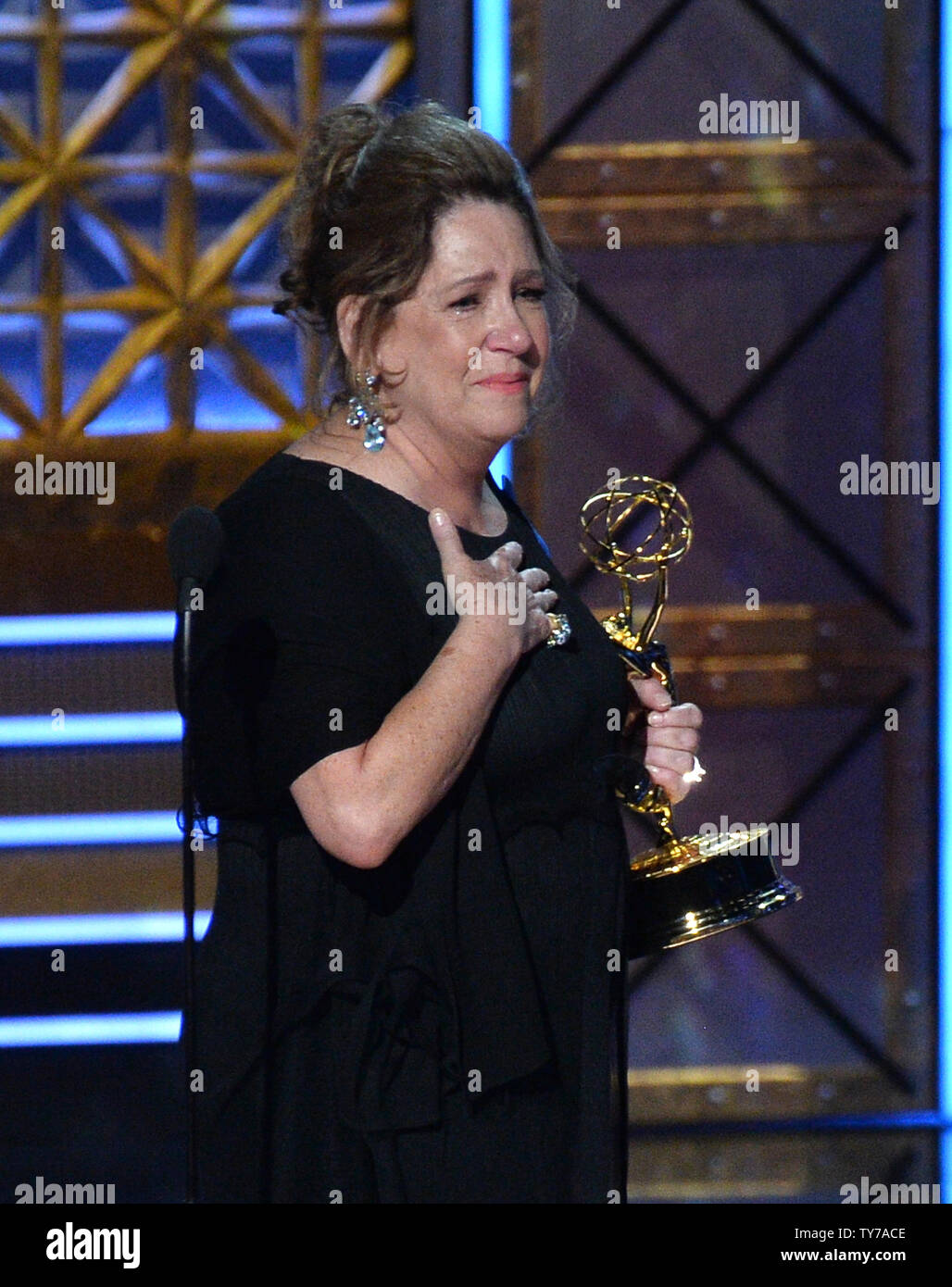 Actor Ann Dowd accepts the award for Outstanding Supporting Actress in ...