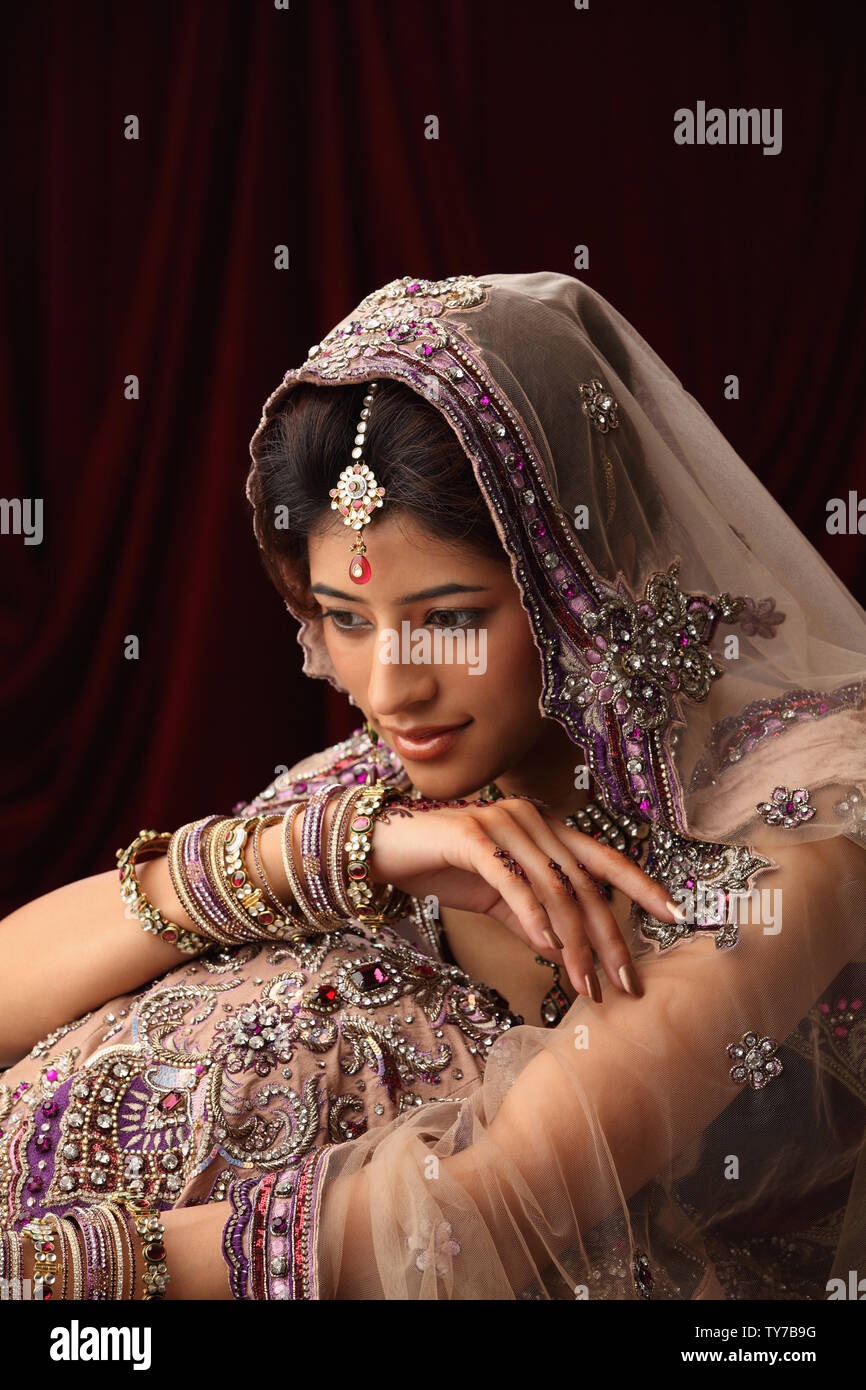 Indian bride sitting Stock Photo - Alamy