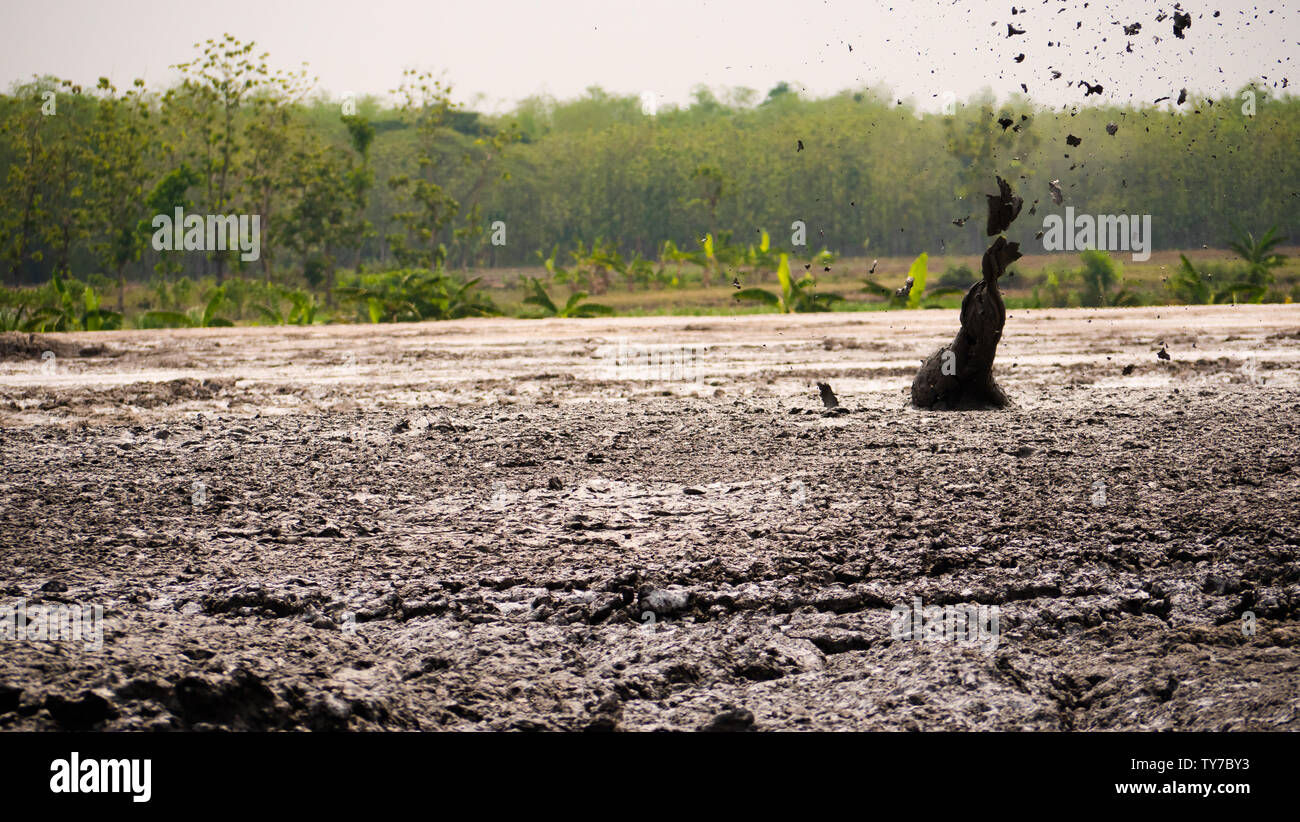mud volcano with bursting bubble bledug kuwu. volcanic plateau with ...