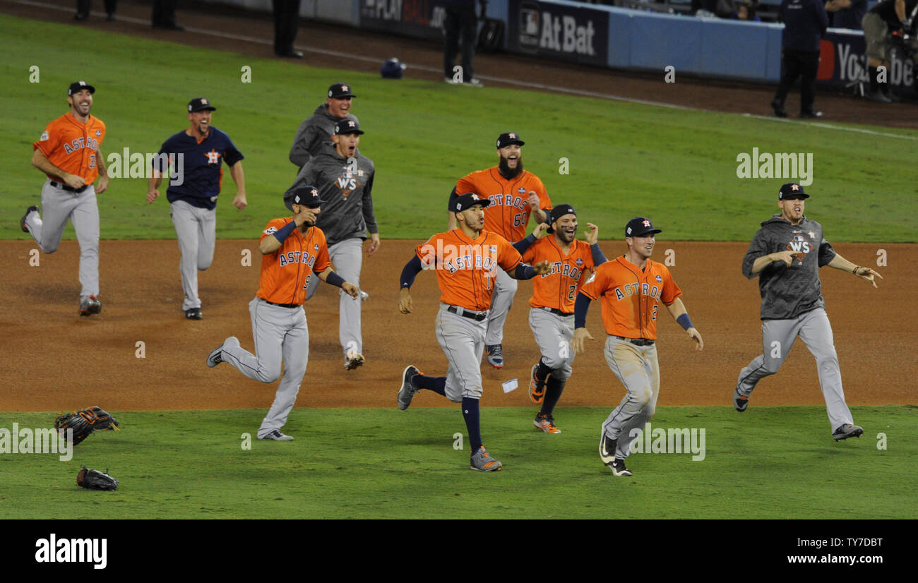 Houston Astros from the bullpen join teammates in the celebration after ...