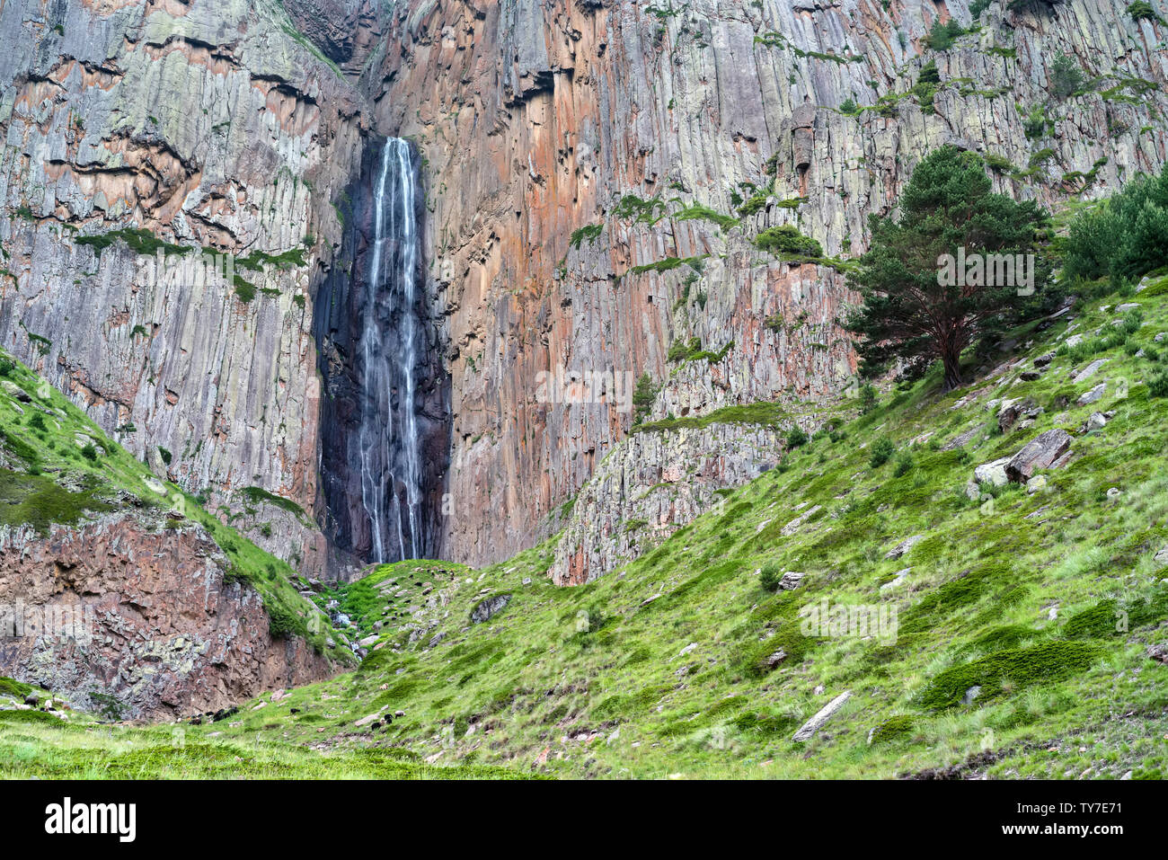 Summer landscape with mountain waterfall between two rocks Stock Photo ...