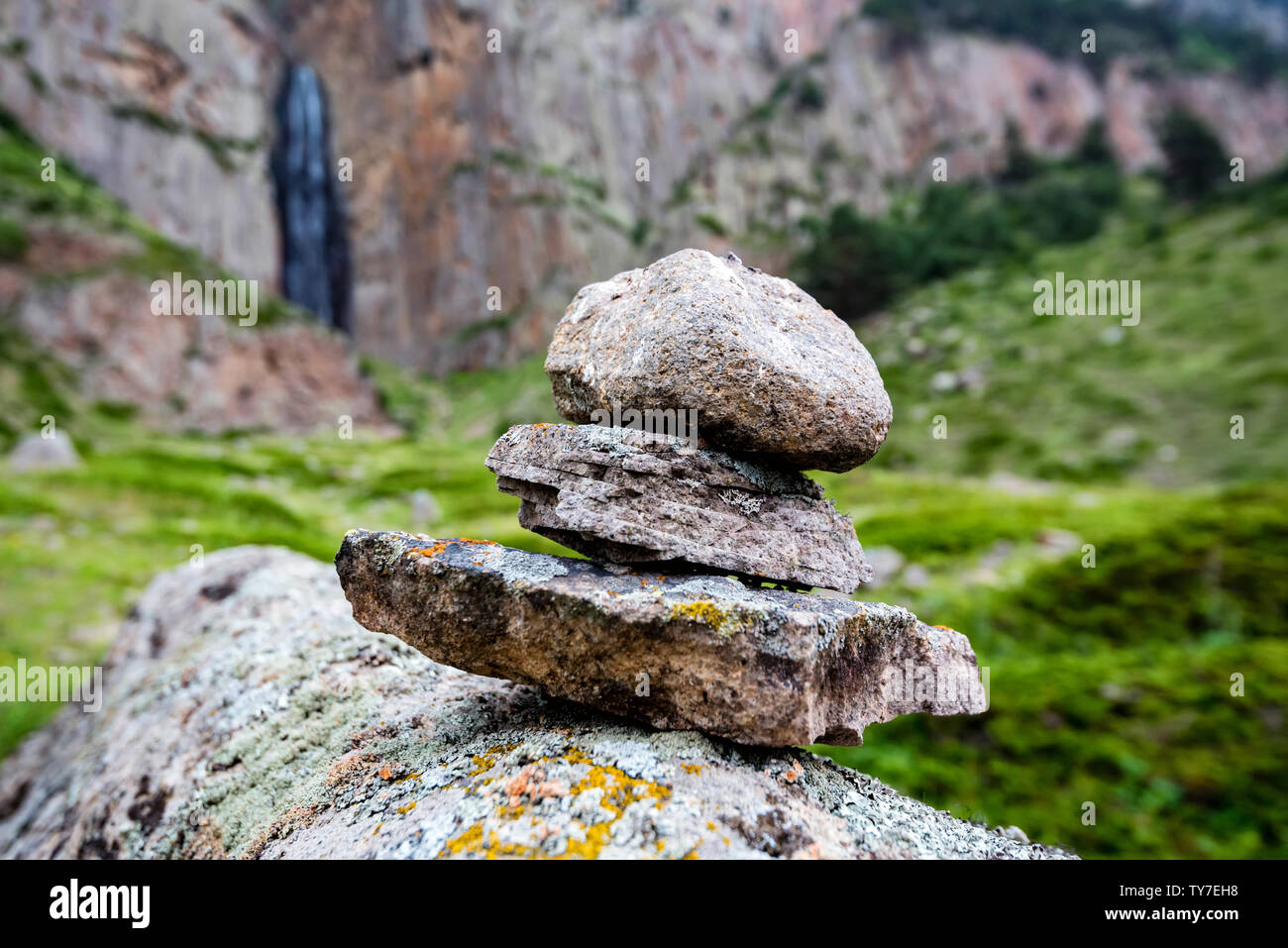 Stone tower of small rocks made in beautiful mountains Stock Photo - Alamy