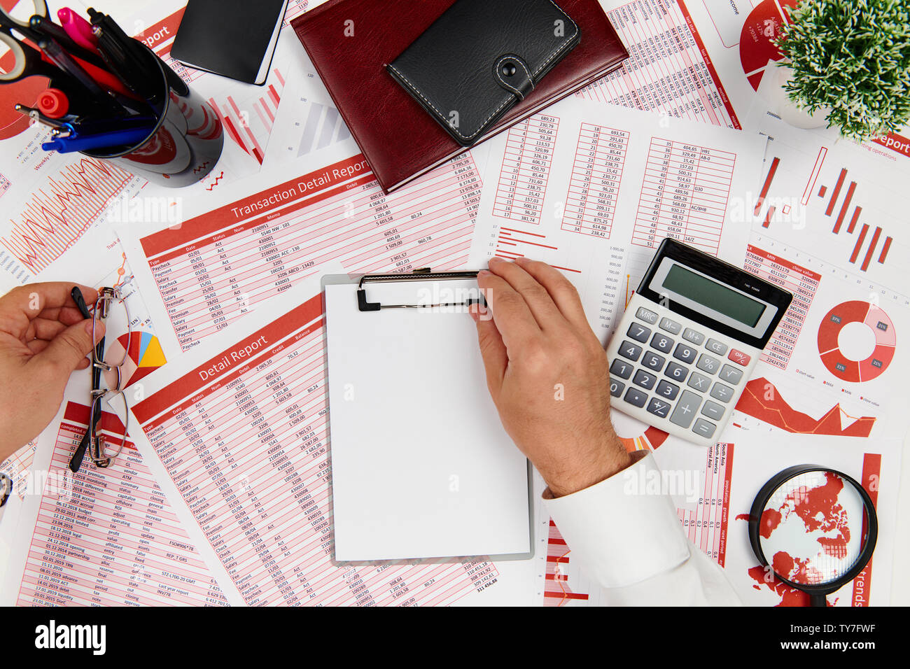 Business reports, data tables and charts - directly above view of ...