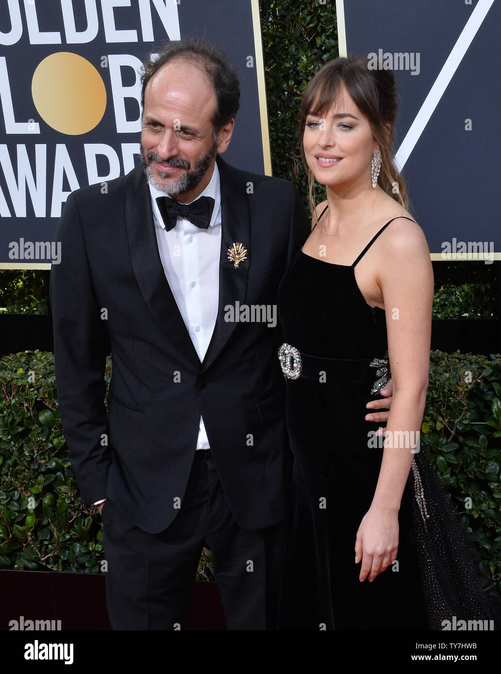 Director Luca Guadagnino (L) and actor Dakota Johnson attend the 75th ...