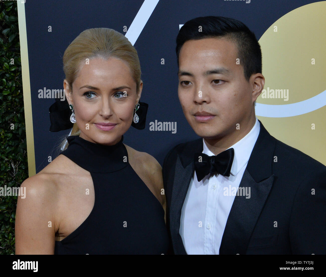 Writer Alan Yang (R) and guest attend the 75th annual Golden Globe ...