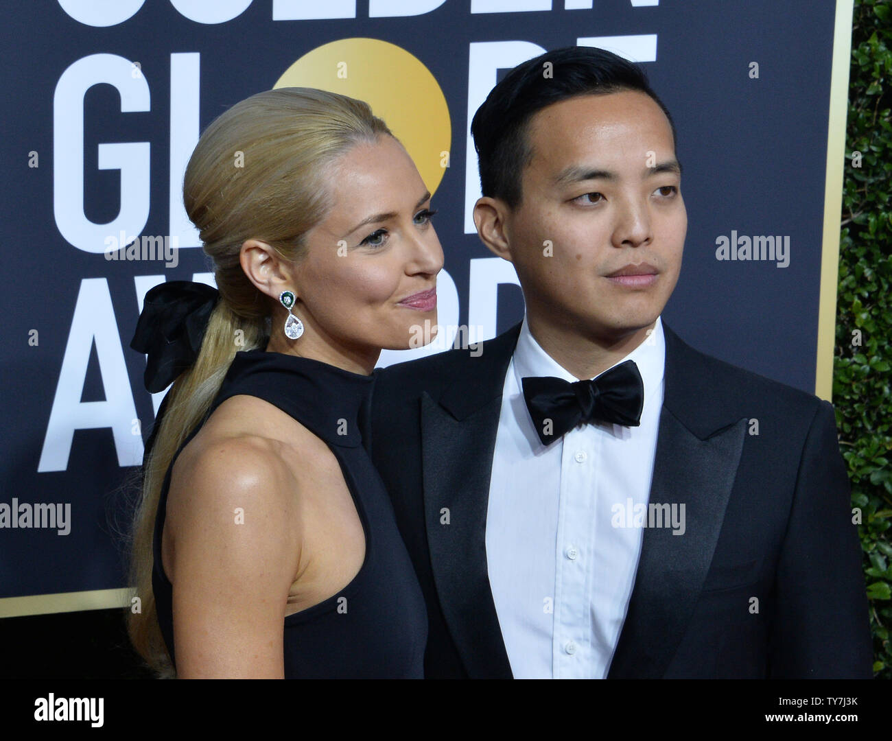 Writer Alan Yang (R) and guest attend the 75th annual Golden Globe ...
