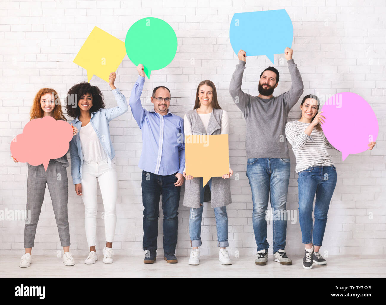 Group of diverse people with colorful speech bubbles Stock Photo - Alamy