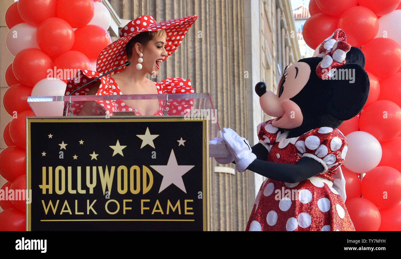 Minnie Mouse is joined by singer Katie Perry during an unveiling ...