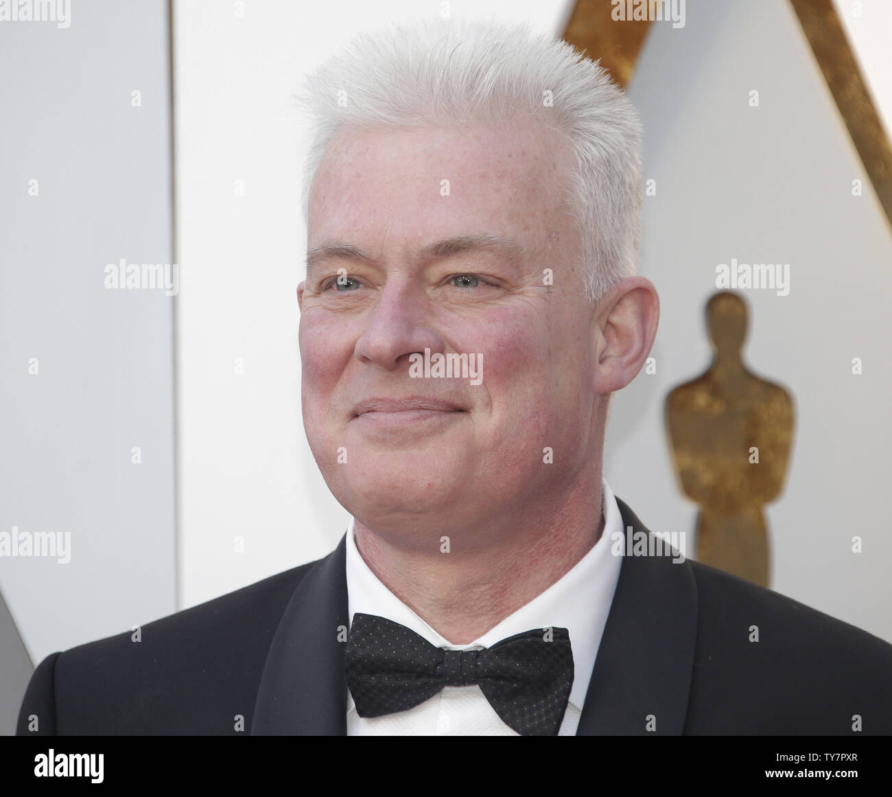 Neil Scanlon arrives on the red carpet for the 90th annual Academy ...