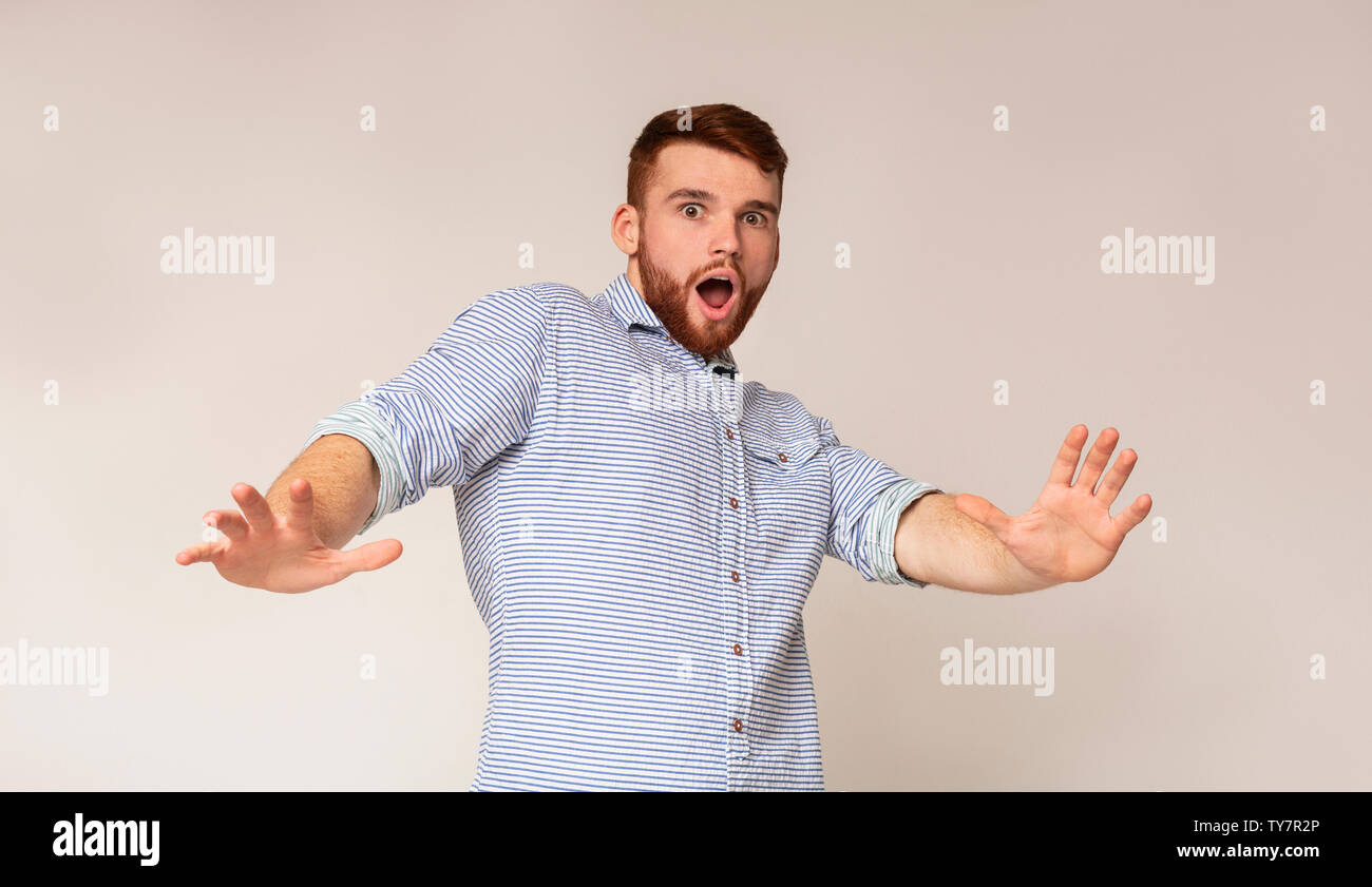 Portrait of scared man with open mouth Stock Photo - Alamy
