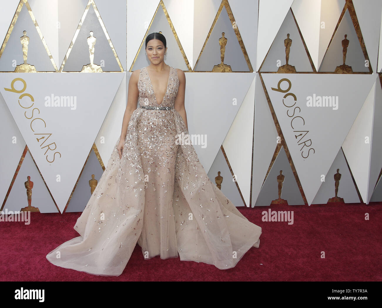 Gina Rodriguez arrives on the red carpet for the 90th annual Academy ...