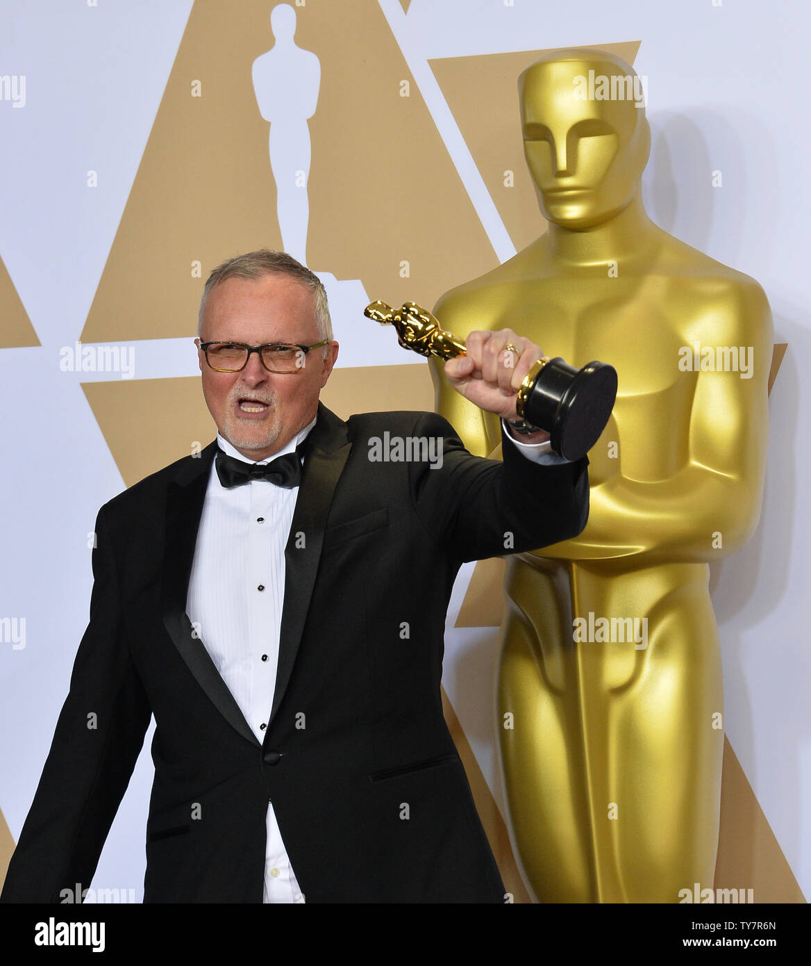 Editor Lee Smith, winner of the award for Best Film Editing award for ...