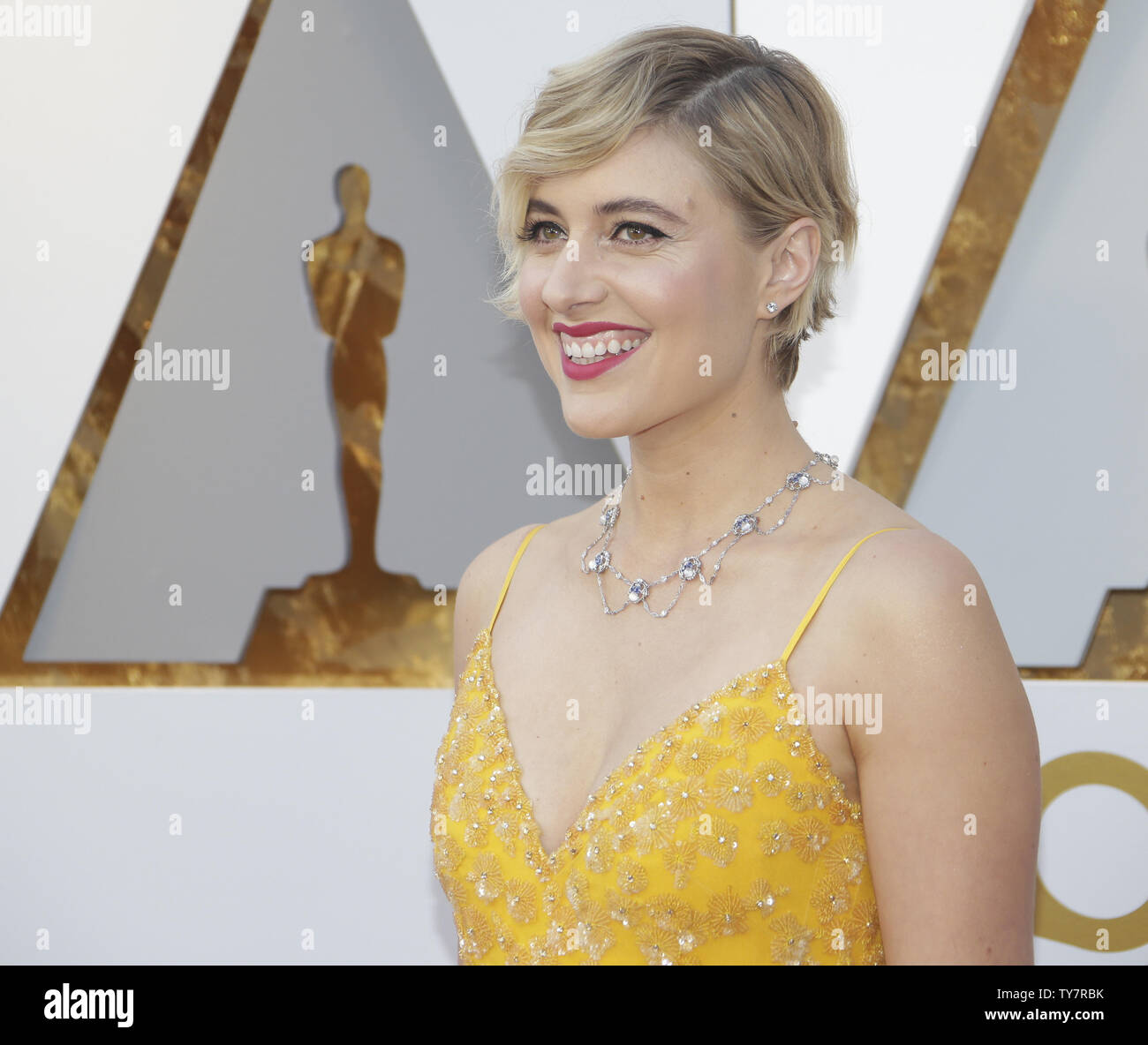 Greta Gerwig arrives on the red carpet for the 90th annual Academy ...