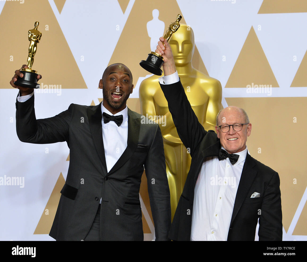 Kobe Bryant (L) and Glen Keane, winners of the Best Animated Short Film ...