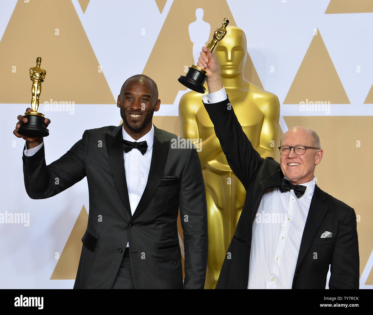 Kobe Bryant (L) and Glen Keane, winners of the Best Animated Short Film ...